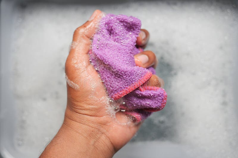 Hand Squeezing a Soapy Cloth in a Washing Basin at Home Stock Photo ...