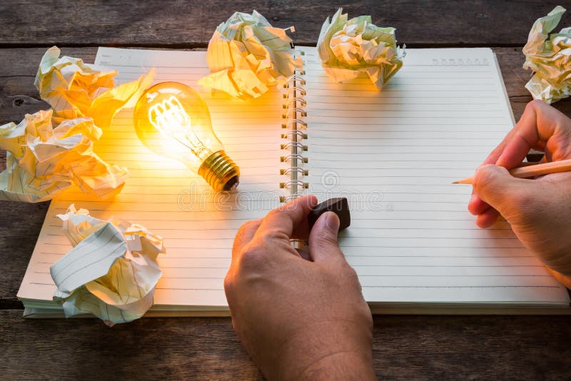 Note book and light bulb stock image. Image of close - 45996617