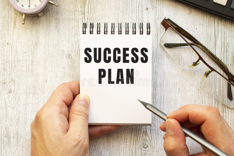 The Hand Writes the Text SUCCESS PLAN in Pencil in a Notebook. View ...
