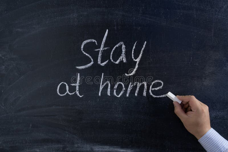 Hand Writing on a Chalkboard `stay at Home`. Stock Photo - Image of ...