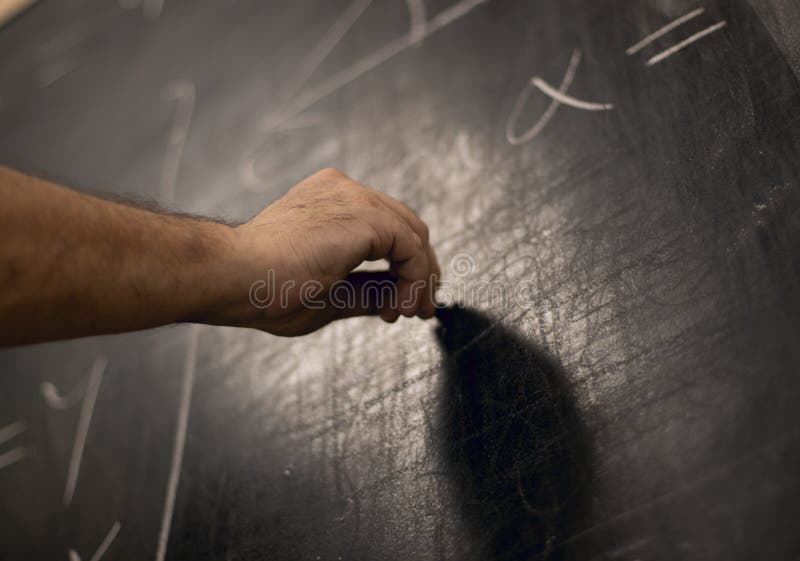 Hand Writing Maths Equations with Chalk on a Blackboard. Perspective ...