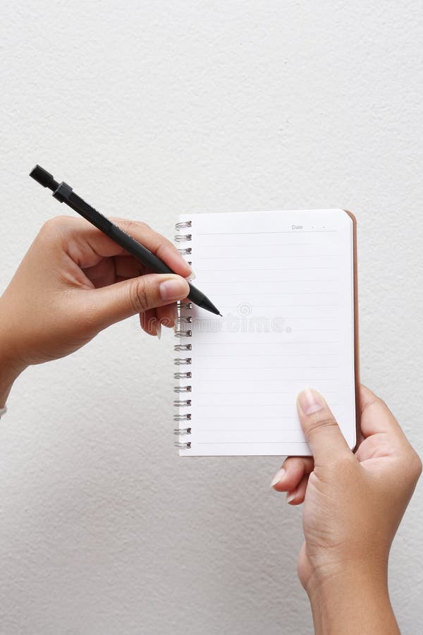 Hand writing on notebook stock photo. Image of metal - 21940404