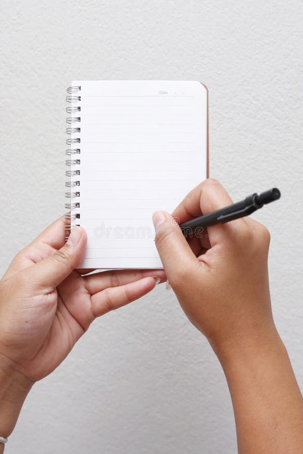 Hand writing on notebook stock photo. Image of right - 21940438