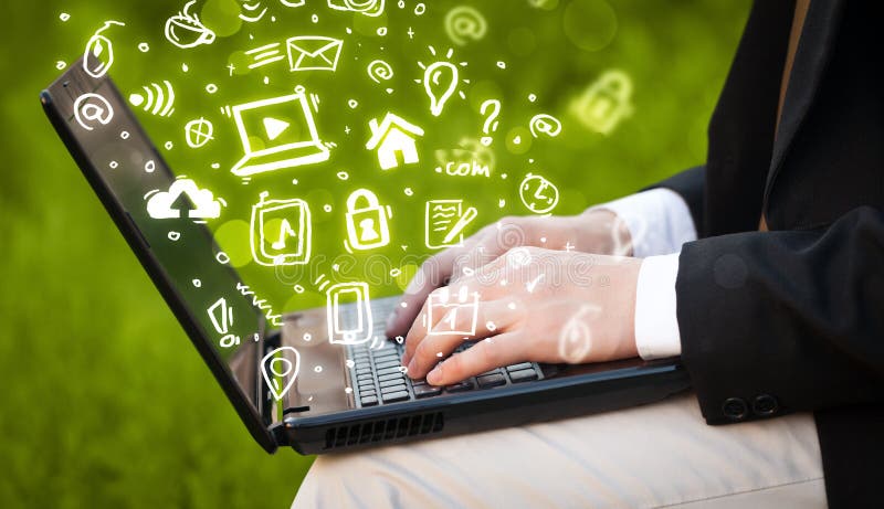 Hand Writing on Notebook Computer with Media Icons and Symbols Stock ...