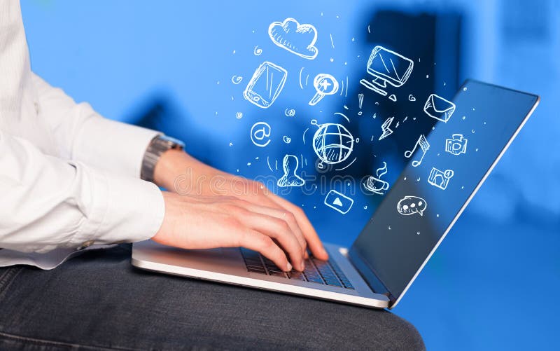 Hand Writing on Notebook Computer with Media Icons Stock Photo - Image ...