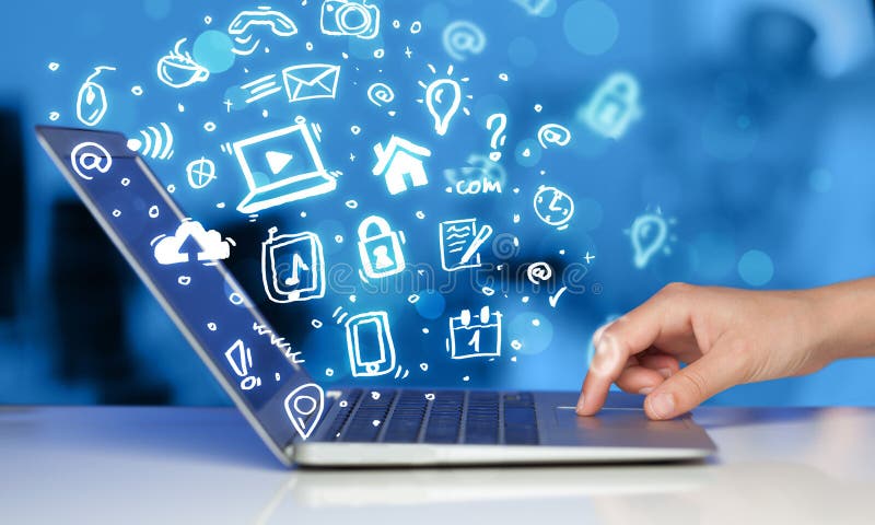 Hand Writing on Notebook Computer with Media Icons and Symbols Stock ...