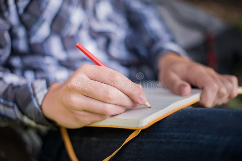 Hand writing in notebook. stock photo. Image of jeans - 76461290