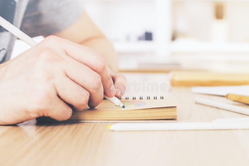 Hand writing in notepad stock photo. Image of male, notepaper - 70726004