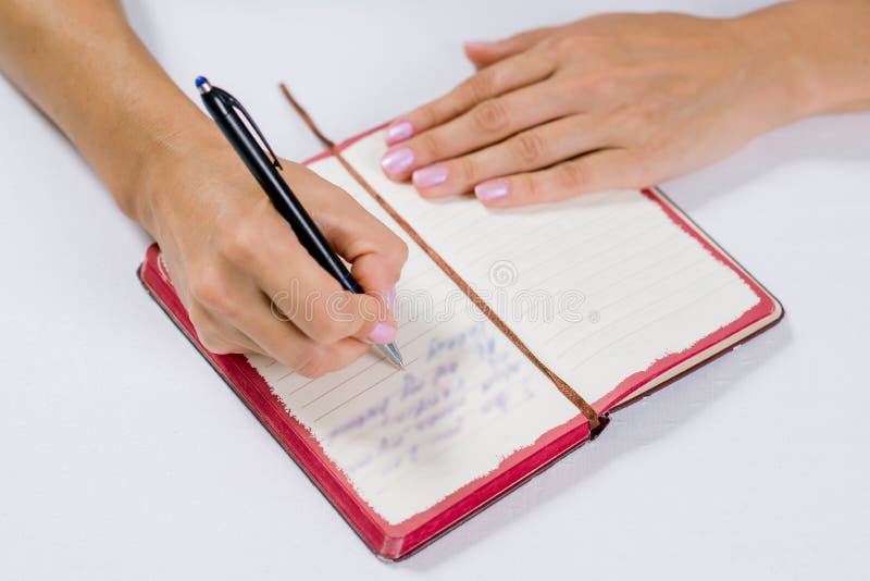 Hand Writing in Open Notebook on Table Stock Image - Image of book ...