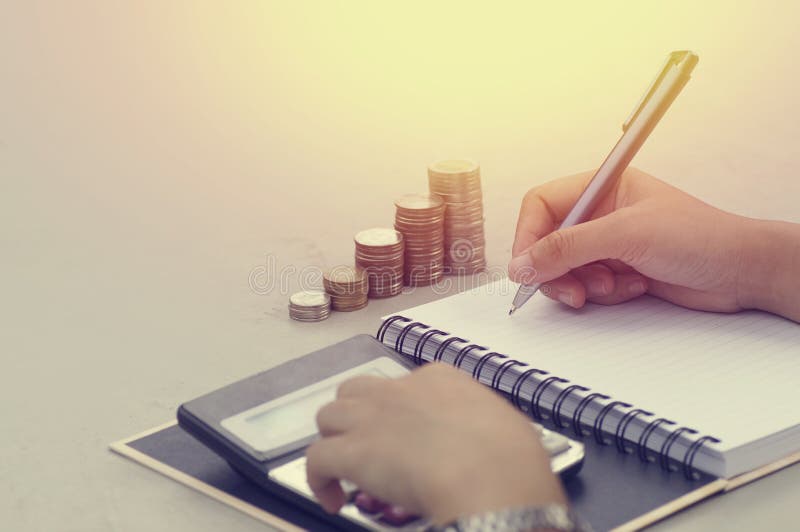 Hand Writing with Pile of Coins Stock Photo - Image of growth, closeup ...