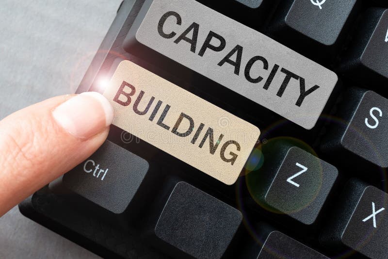 Hand Writing Sign Capacity Building. Word for Process by Which ...