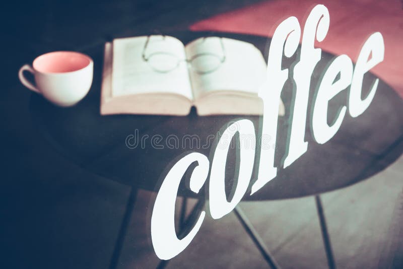 Hand Written Coffee at Glass of Cafe with Cup of Coffee or Te Stock ...