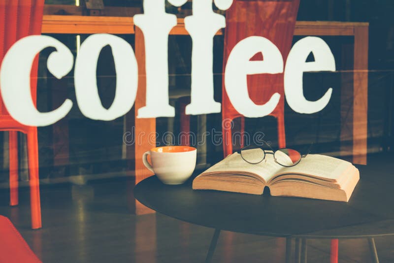 Hand Written Coffee at Glass of Cafe with Cup of Coffee or Te Stock ...