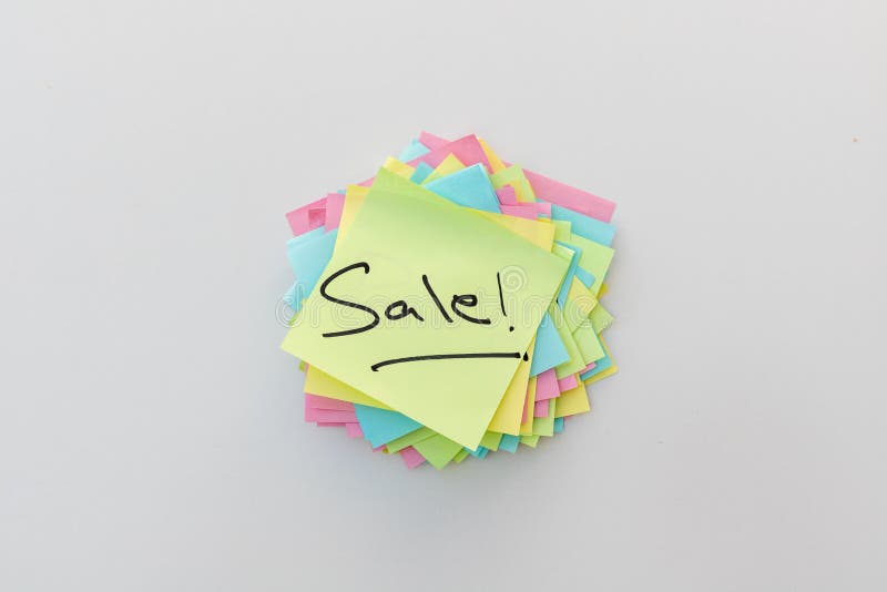 Hand Written Memo or Reminder of a Word SALE on a Sticky Note Stock ...