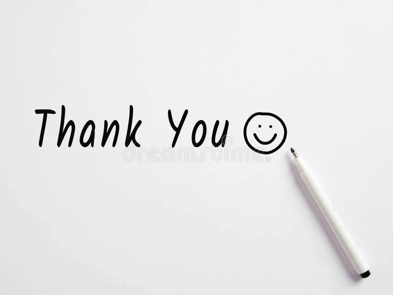 Hand Written Thank You Message on White Background Wit a Smiling ...
