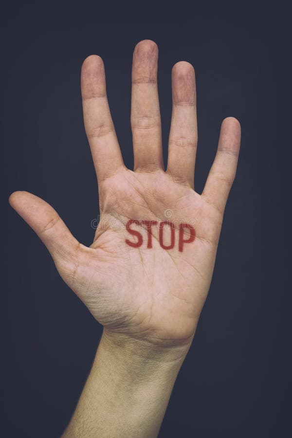 Hand with writting Stop stock photo. Image of symbol - 72492442