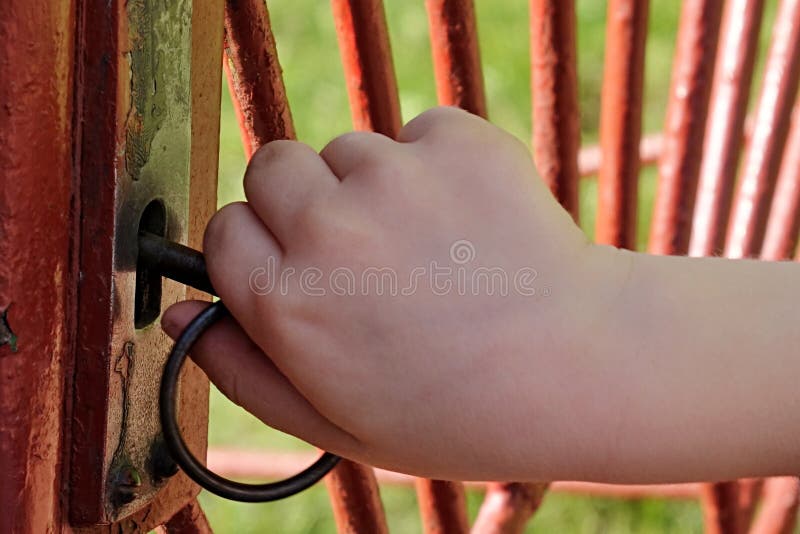 Hand of 6 Years Old Boy Unlocking Old Gate Lock Stock Photo - Image of ...