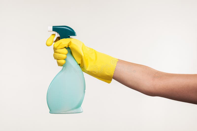 Hand in Yellow Glove Spraying Liquid Cleaning Detergent in the Air ...