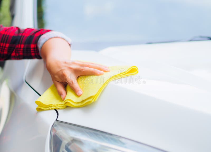 Hand with Yellow Microfiber Cloth Cleaning White Car. Stock Photo ...