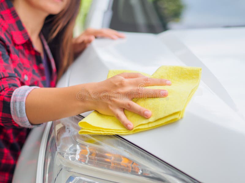 Hand with Yellow Microfiber Cloth Cleaning White Car. Stock Photo ...