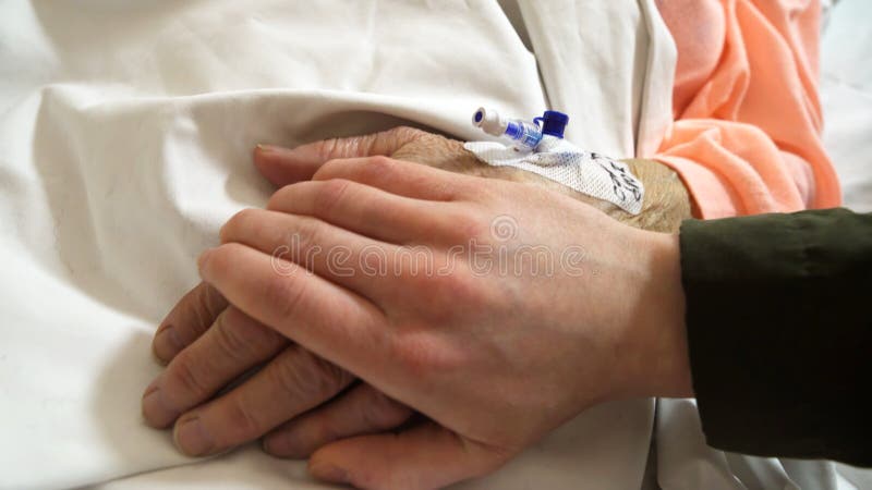 Hand of Young Person Confronting Elderly Sick Person Admitted in ...