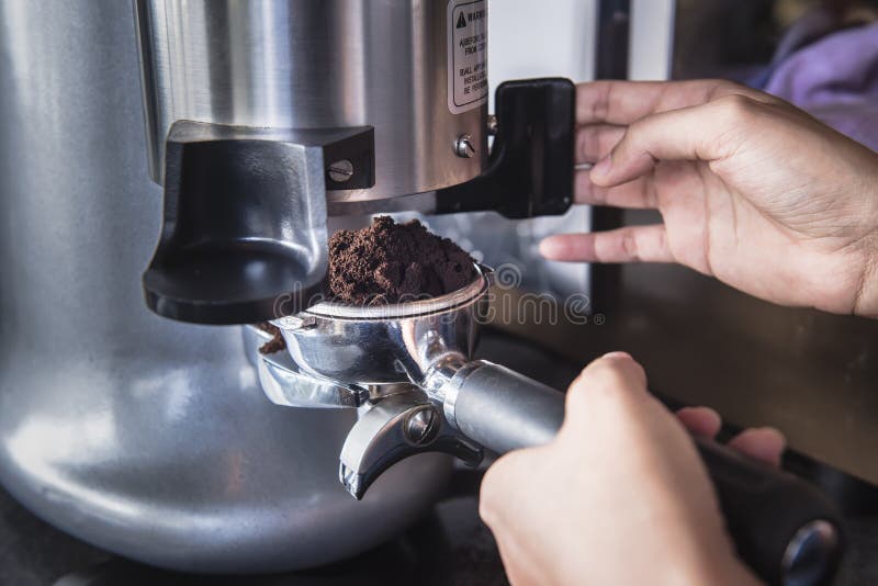 The Hand of a Young Woman is Operating a Professional Coffee Machine ...