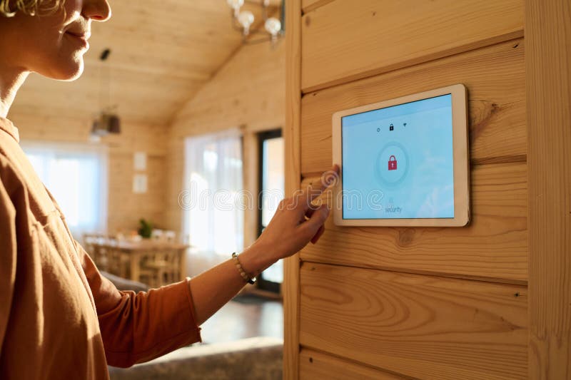 Hand of Young Woman on Panel of Alarm System with Lock Sign on Screen ...