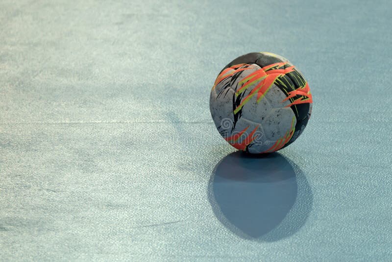 Handball ball on field stock photo. Image of blue, hand - 81306788