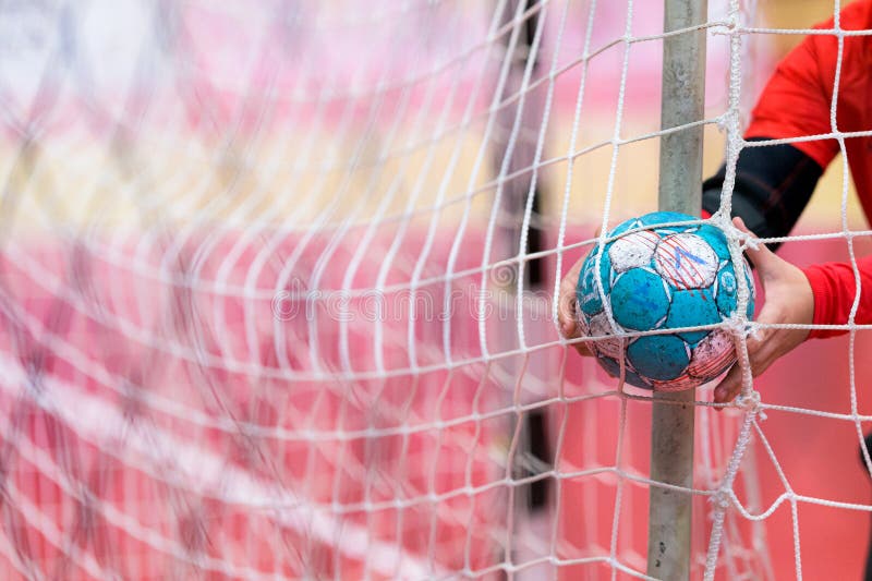Handball ball in the nest stock image. Image of player - 295664679