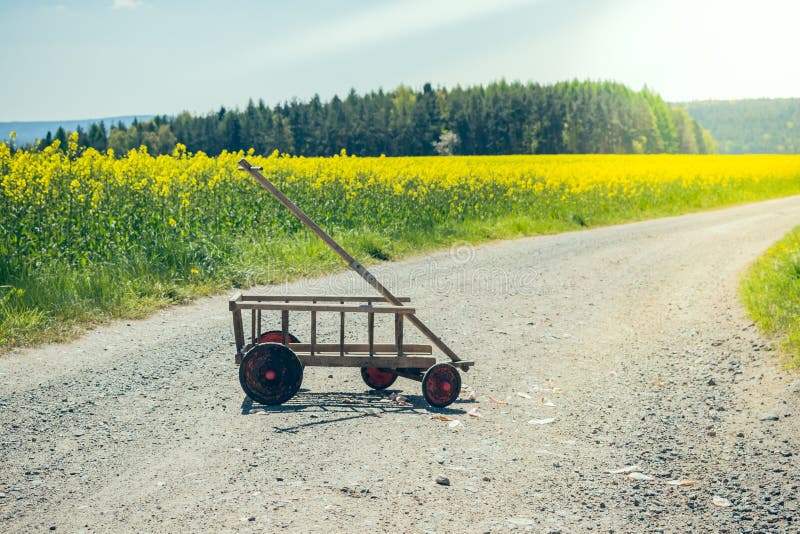 Handcart on a dirt road stock photo. Image of spring - 71817272
