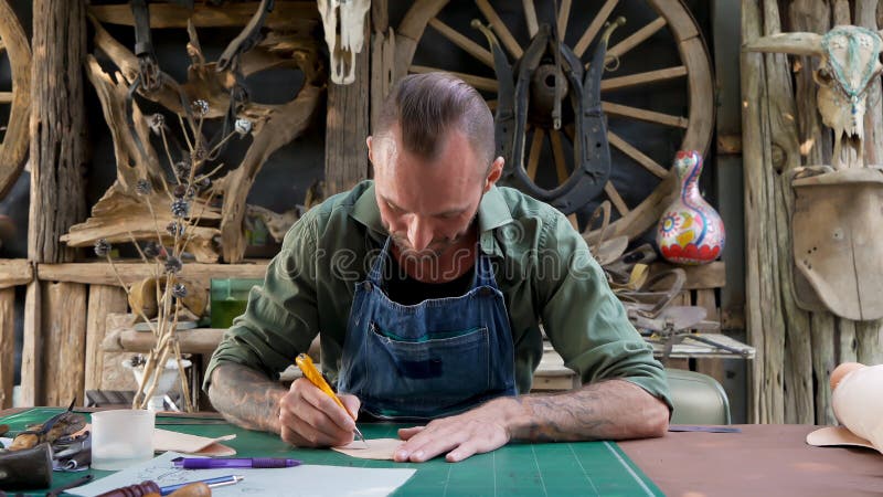 Handcrafted Leather Worker Sits Cowhide with Cutter According Pattern ...