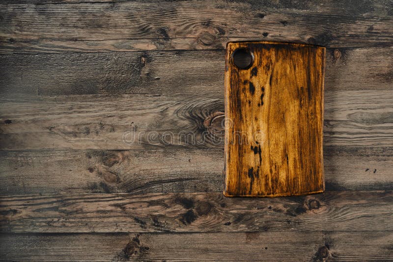 Handcrafted Wooden Cutting Board Displayed on Rustic Wooden Surface ...