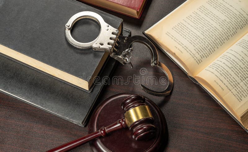 Handcuff with Gavel and Law Books Table Top - Justice Theme Stock Image ...