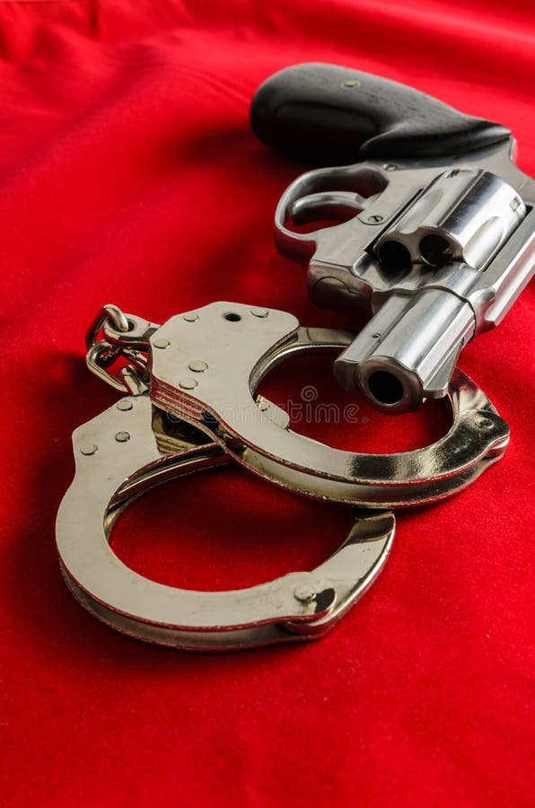 Handcuff and gun stock photo. Image of guilt, automatic - 58471446