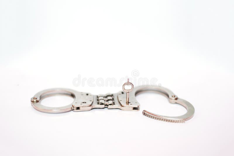 Handcuff with key on white stock photo. Image of iron - 138175988