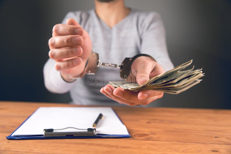 Handcuffed gives money stock image. Image of businessman - 216014779