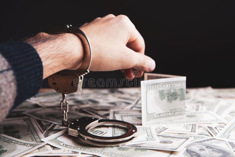 Handcuffed at the Table with Money Stock Image - Image of cash ...