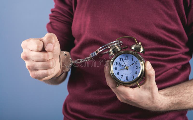 Handcuffed Young Man`s Hands are Chained To His Watch Stock Image ...