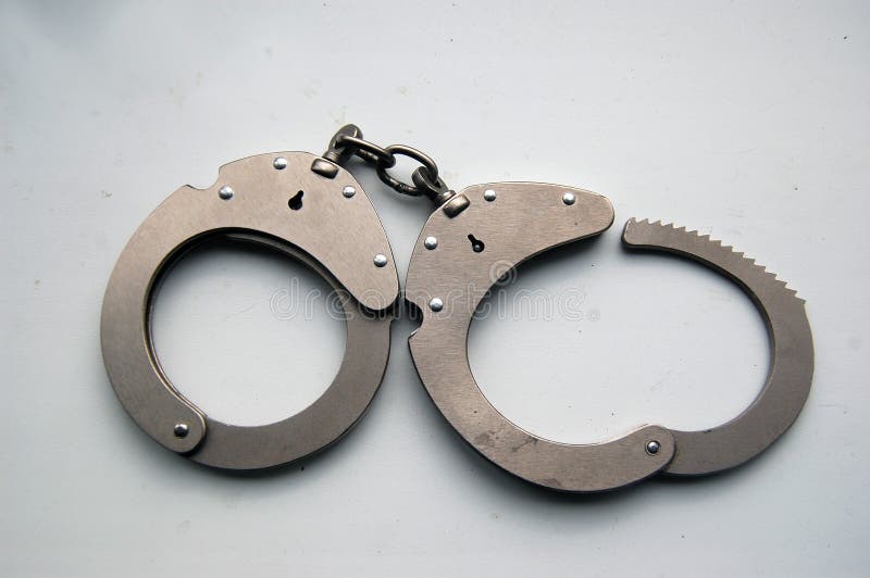 Handcuffs stock photo. Image of hand, arrested, enforcement - 1420630