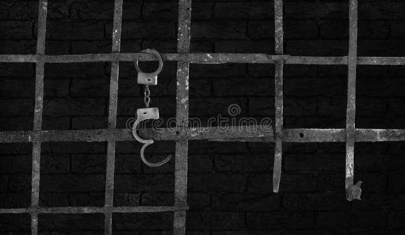 Handcuffs on Bars in Prison Cell Stock Image - Image of confinement ...
