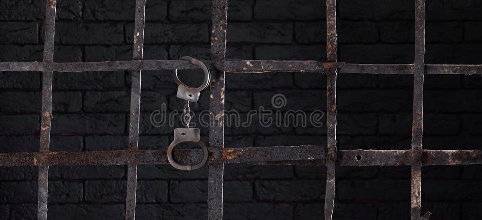 Handcuffs on Bars in Prison Cell Stock Photo - Image of abstract, jail ...