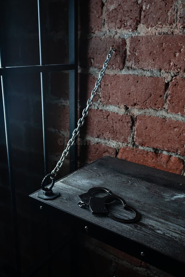 Handcuffs are on the Bench in the Prison Cell Stock Image - Image of ...