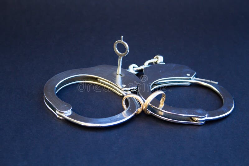 Handcuffs Binding Two Wedding Rings Stock Image - Image of hand ...