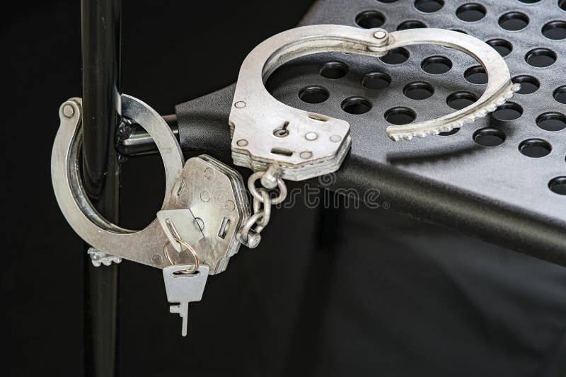 Handcuffs are Chained To a Chair and Prepared for the Interrogation of ...