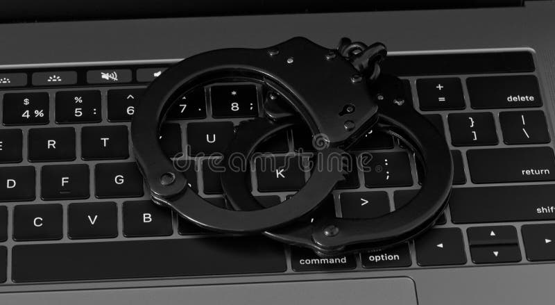 Handcuffs on Computer Keyboard Stock Image - Image of handcuff ...