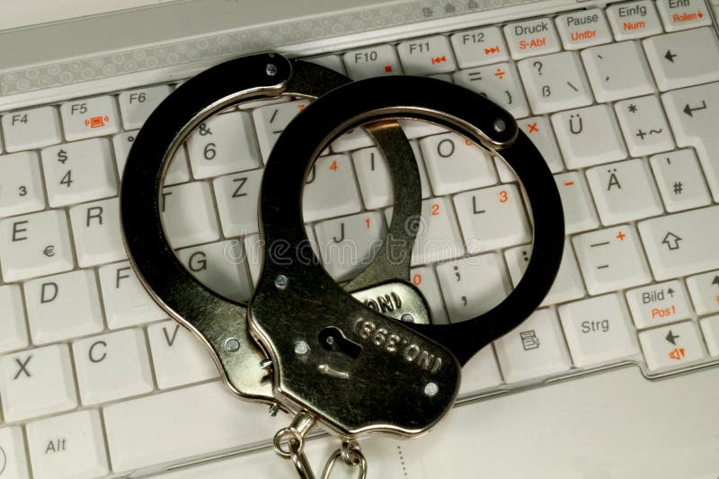 Handcuffs and Computer stock image. Image of protection - 57221199