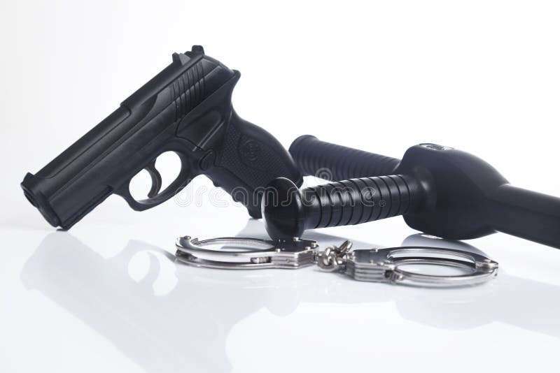 Handcuffs and police gun stock image. Image of criminal - 44391367