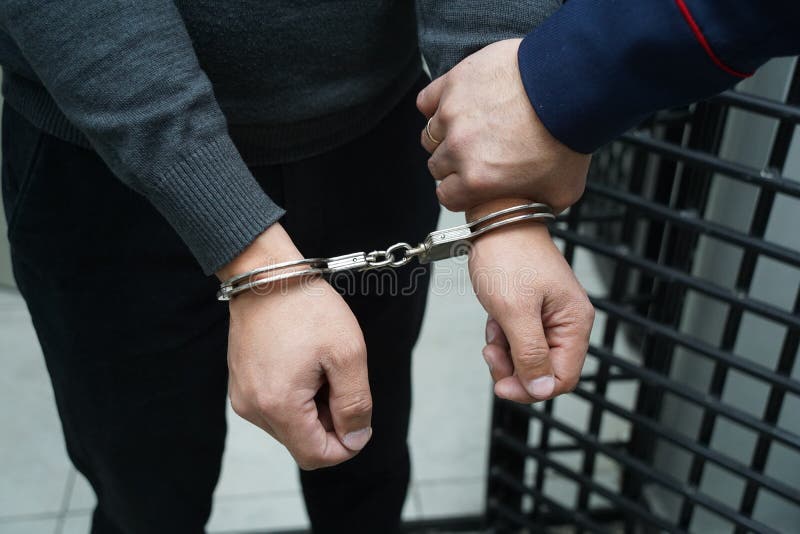 A Police Officer Handcuffs A Suspect Stock Image Image Of Almaty