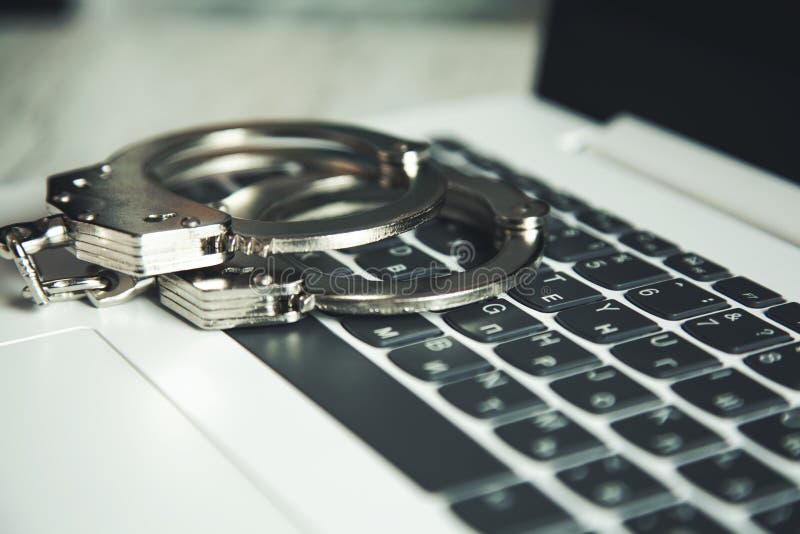 Handcuffs on keyboard stock image. Image of theft, cyber - 135789091