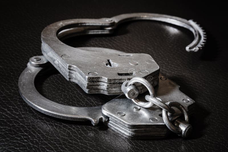 The Handcuffs are Lying on the Leather Seat of a Police Car Stock Image ...